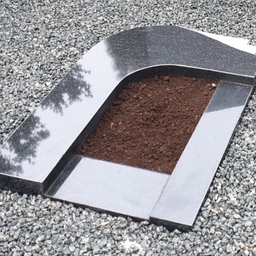 Open granite gravestone for an urn burial site